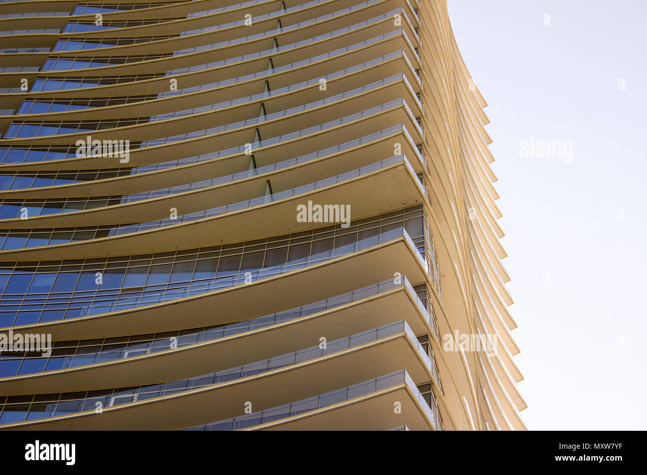 Side view of a modern corporate office building with yellow overhangs ...