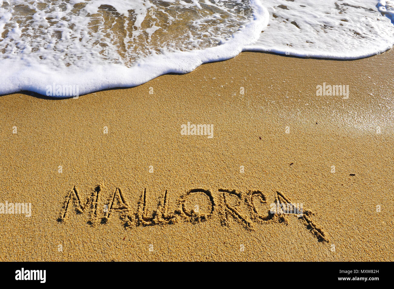 Mallorca sign on the beach, summer background Stock Photo - Alamy
