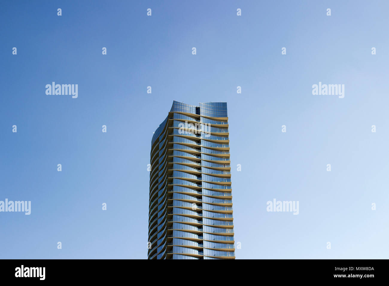 Wide front view of a modern corporate high-rise office building with ...