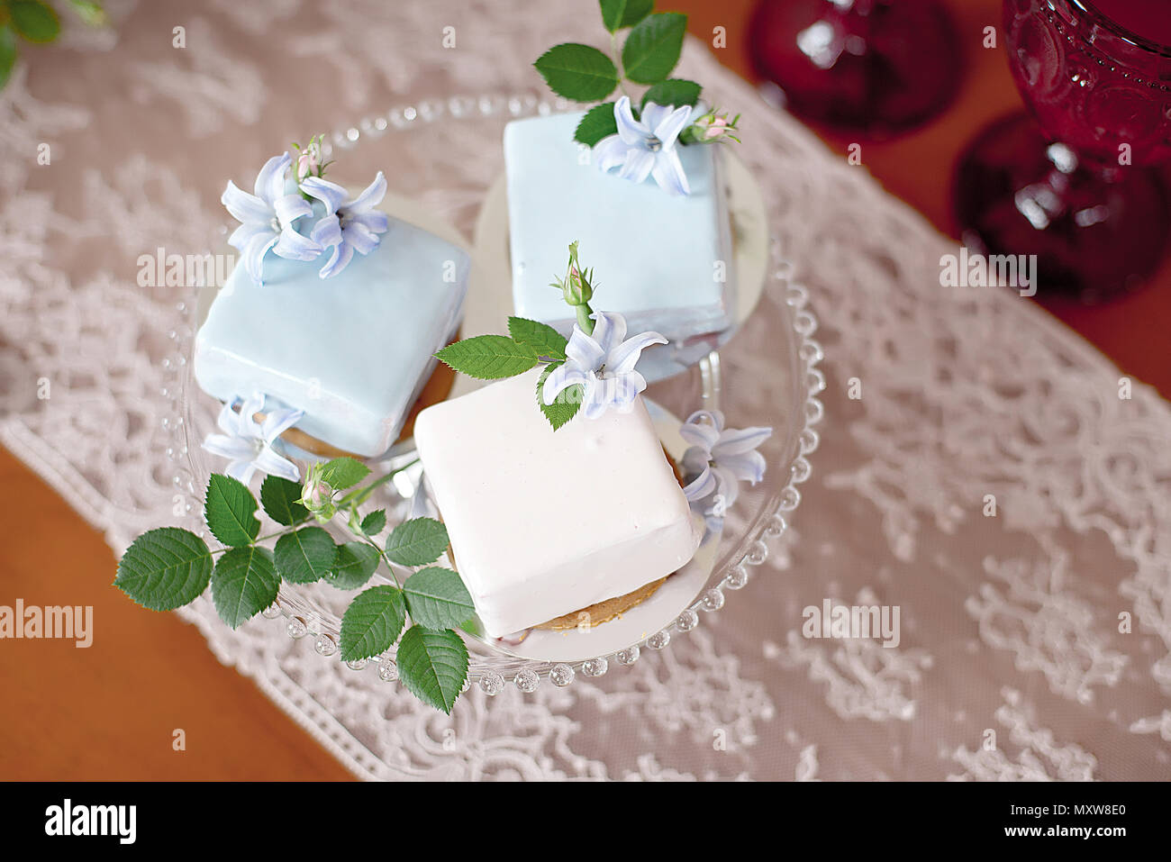square form mirror glazed cakes in crystal vase Stock Photo - Alamy