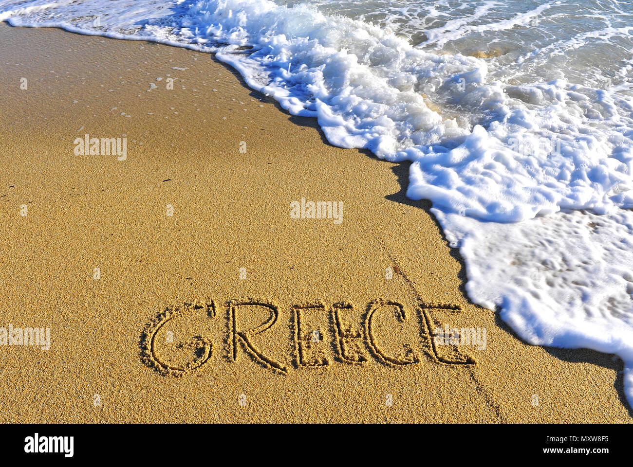 Greece sign on the beach, summer time Stock Photo - Alamy