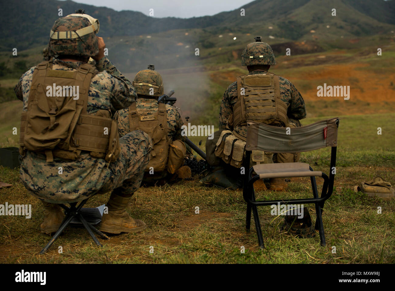 EASTERN TRAINING AREA, OKINAWA, Japan – Marines send rounds down range ...