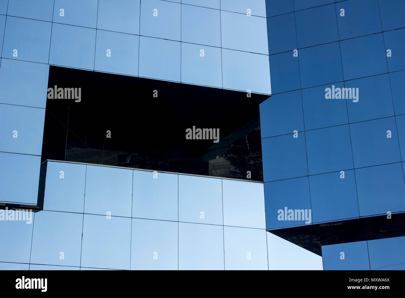 Close shot of a smooth modern glass window wall façade Stock Photo - Alamy
