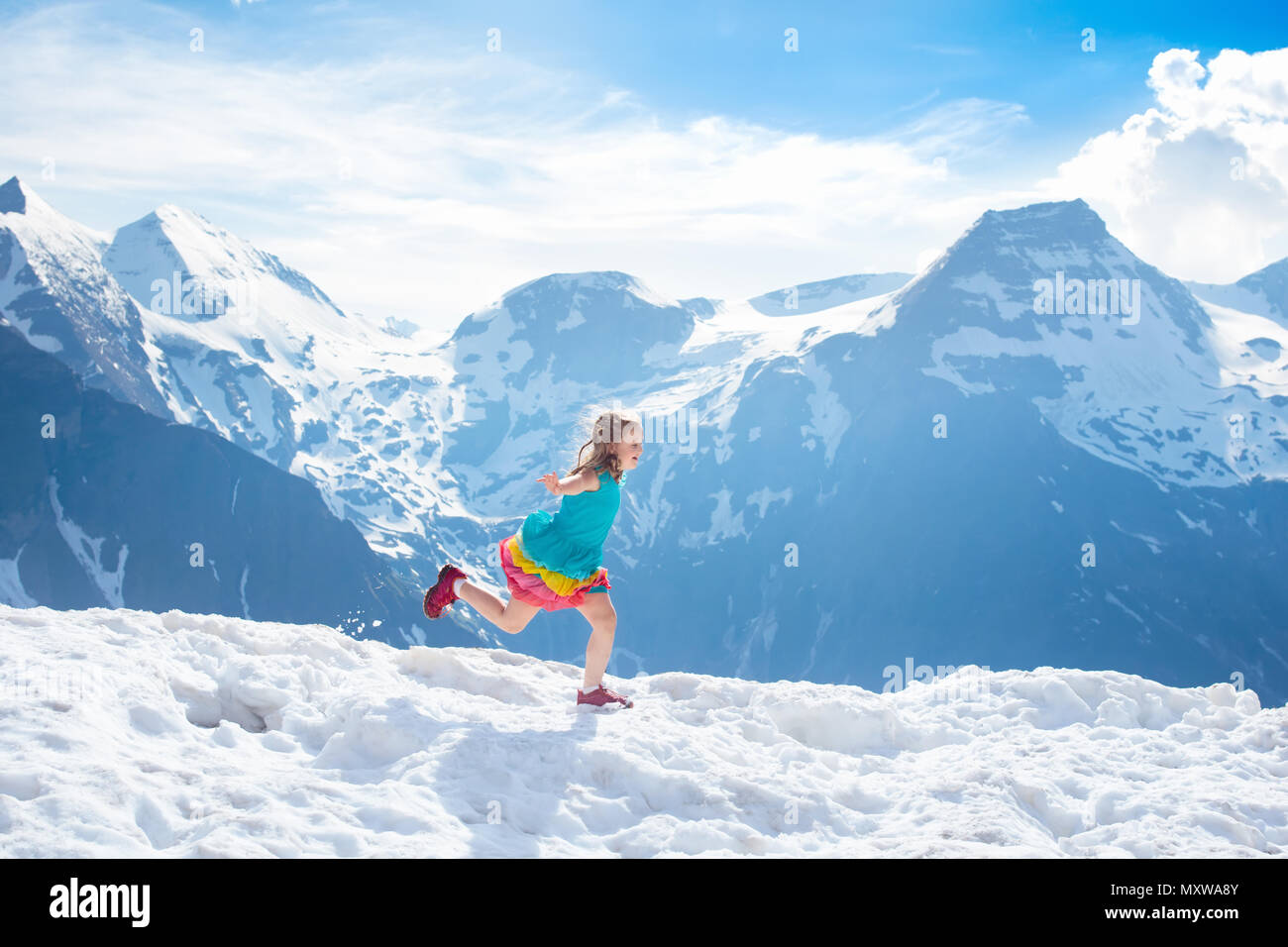 Children hiking in Alps mountains, Austria. Kids at snow covered ...