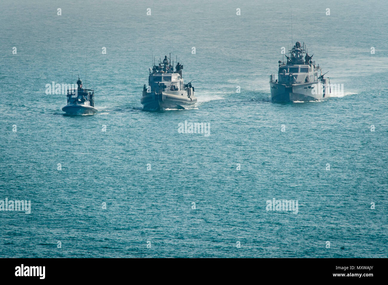 A Sea Ark patrol boat, Coastal Command boat, and Mark VI patrol boat ...