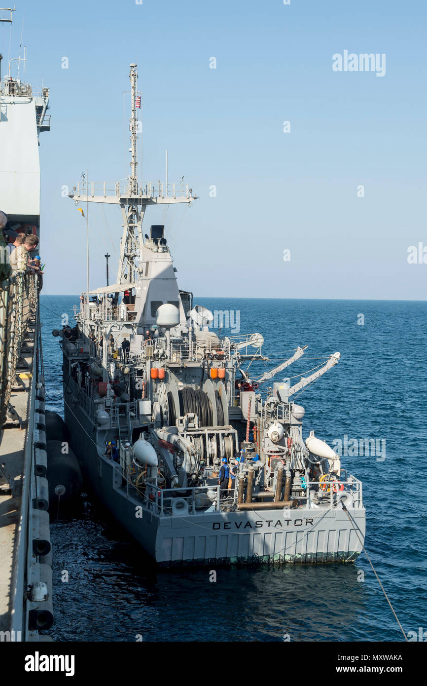 The mine countermeasure (MCM) ship USS Devastator (MCM 6) rafts with ...