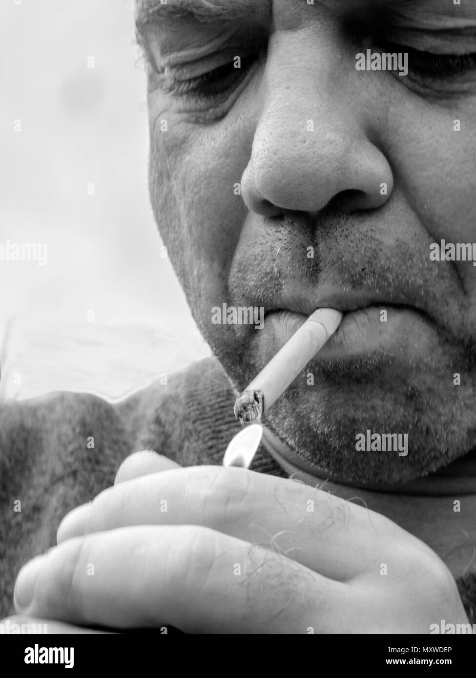 Stylish man smoking cigarette Black and White Stock Photos & Images - Alamy