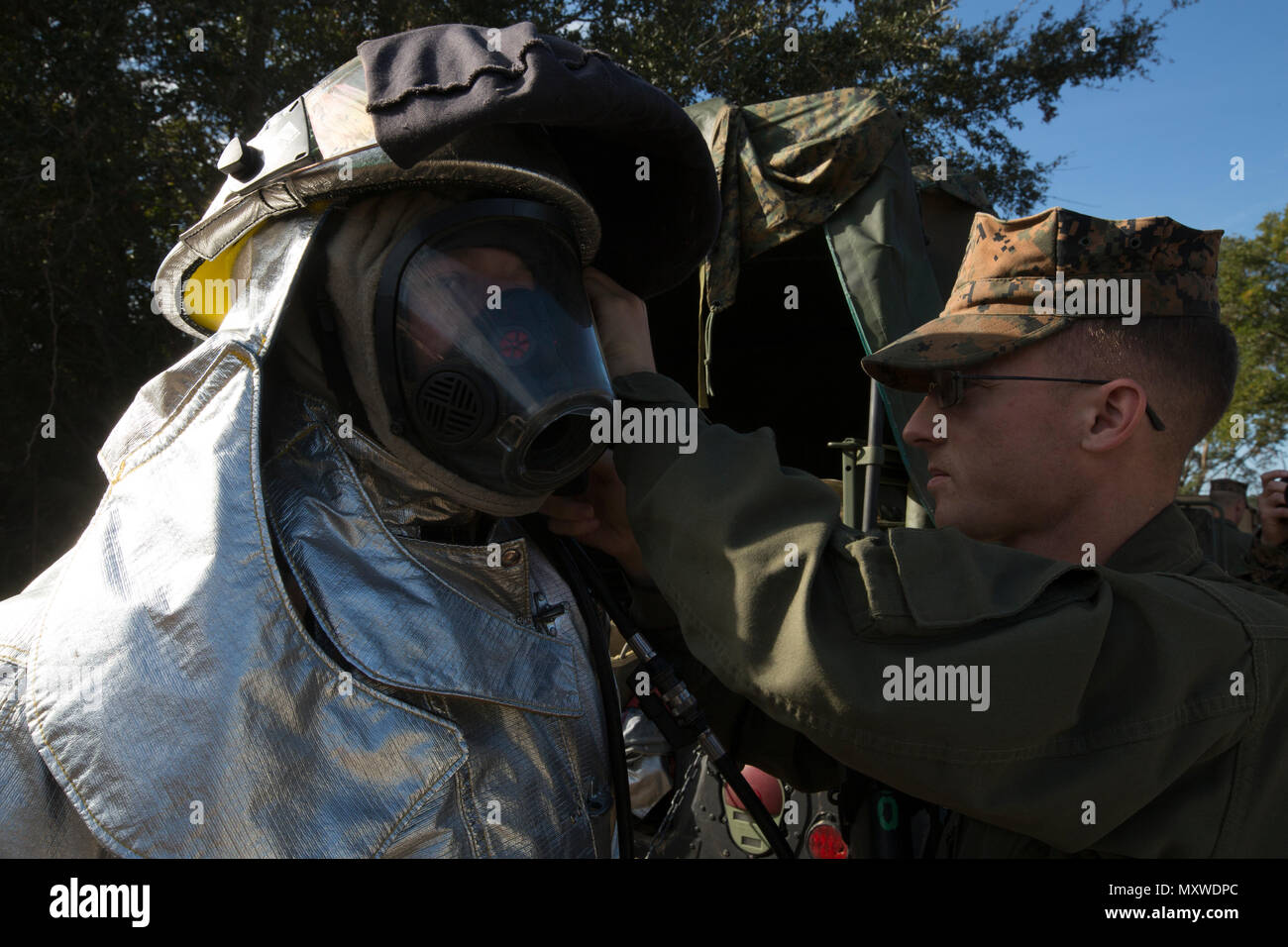 Lance Cpl. Brandon Black is inspected by Cpl. Darrell Powers during a ...