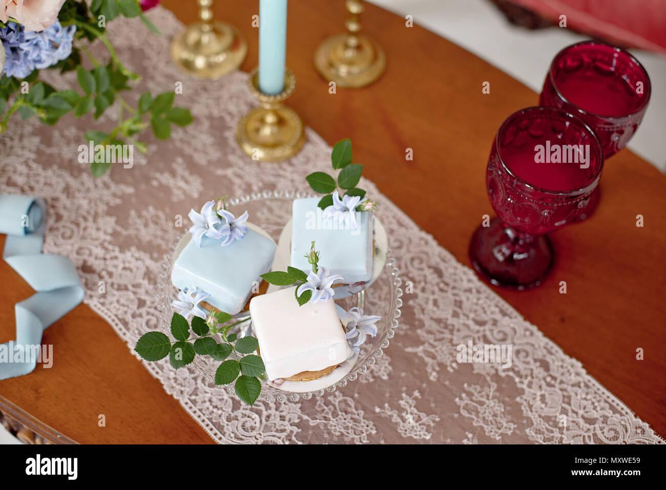 square form mirror glazed cakes in crystal vase Stock Photo - Alamy