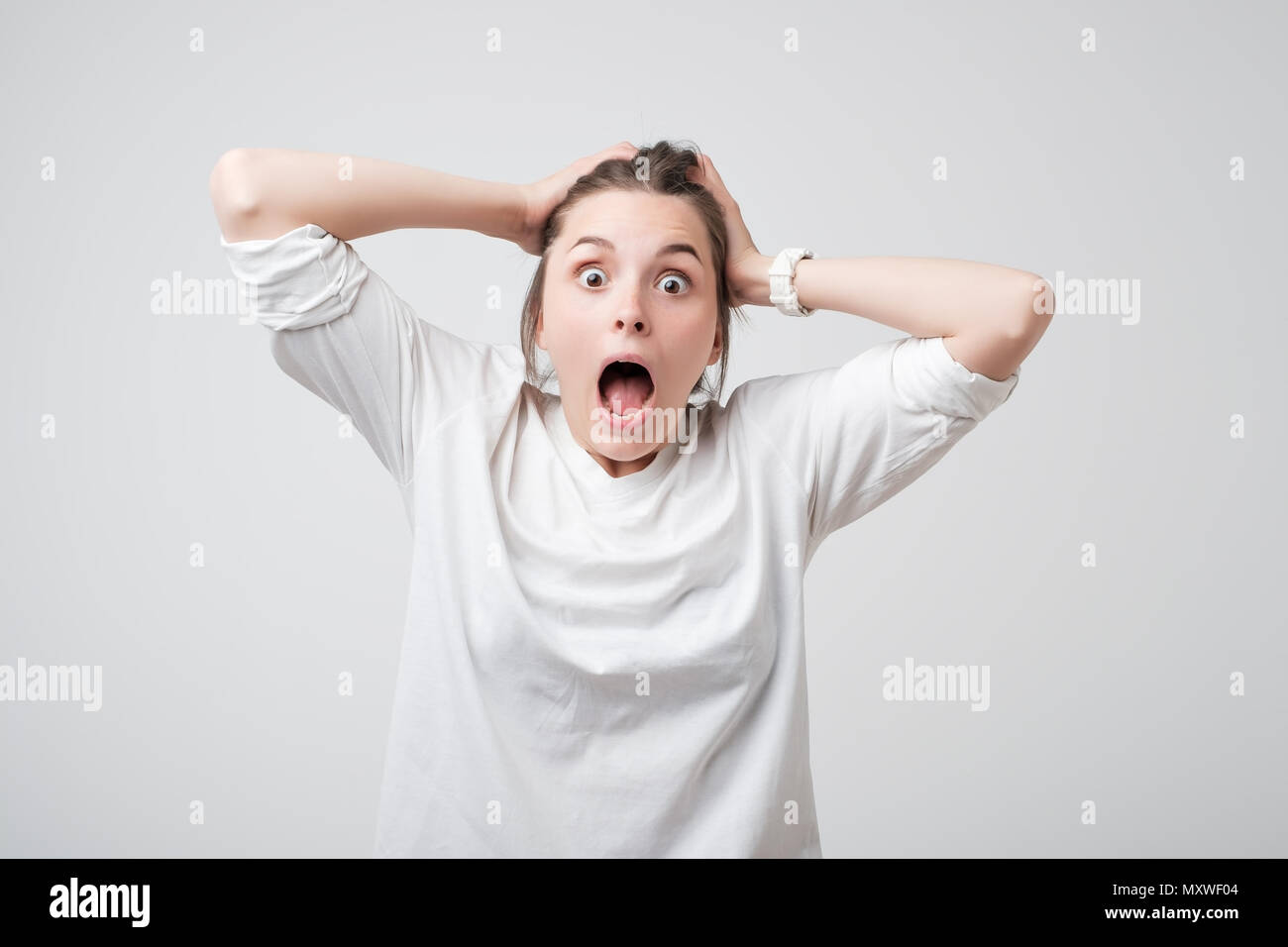 Shocked girl looking camera hi-res stock photography and images - Alamy