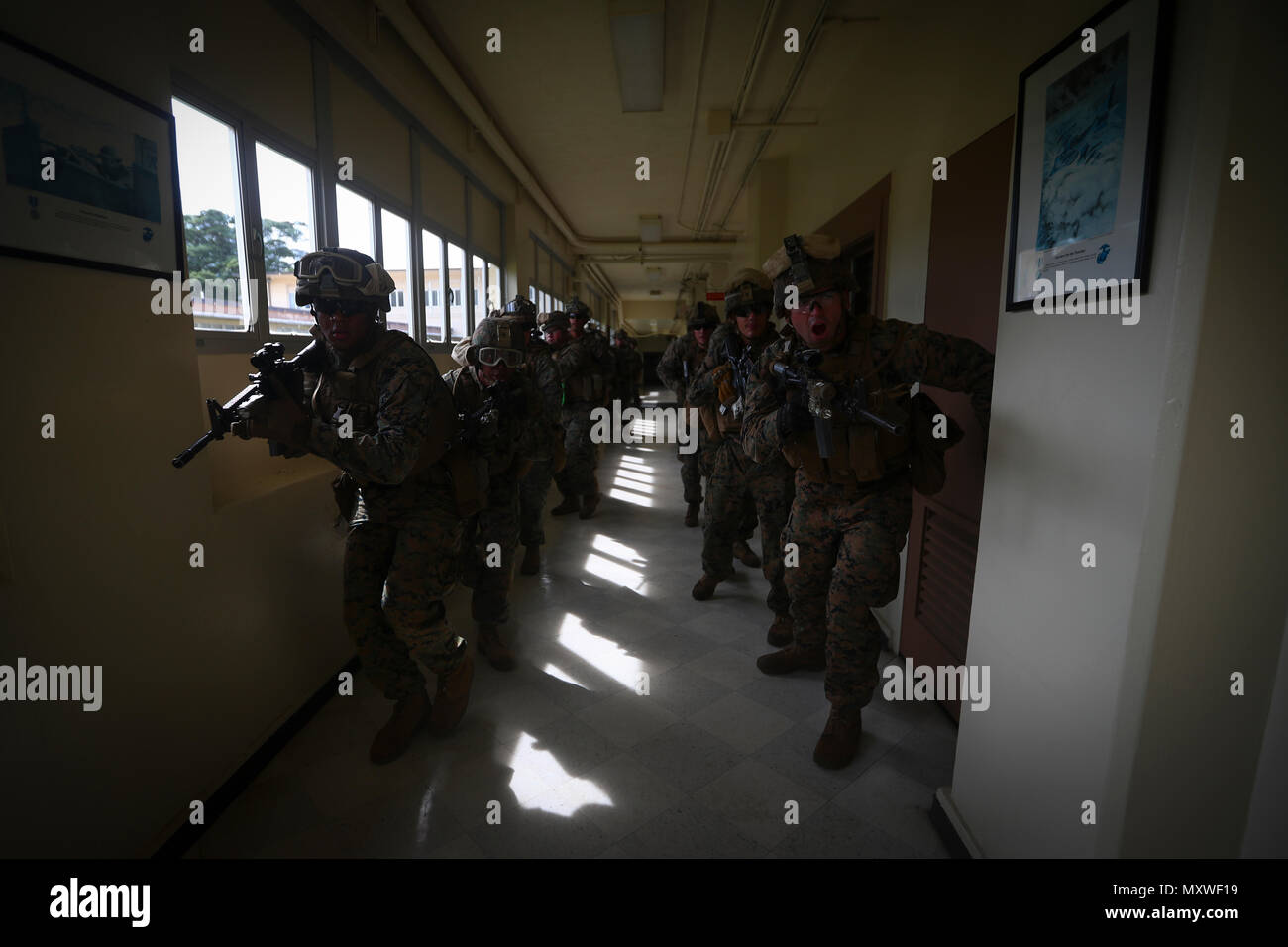 Marines with Alpha Company, 1st Battalion, 3rd Marine Regiment, clear a ...