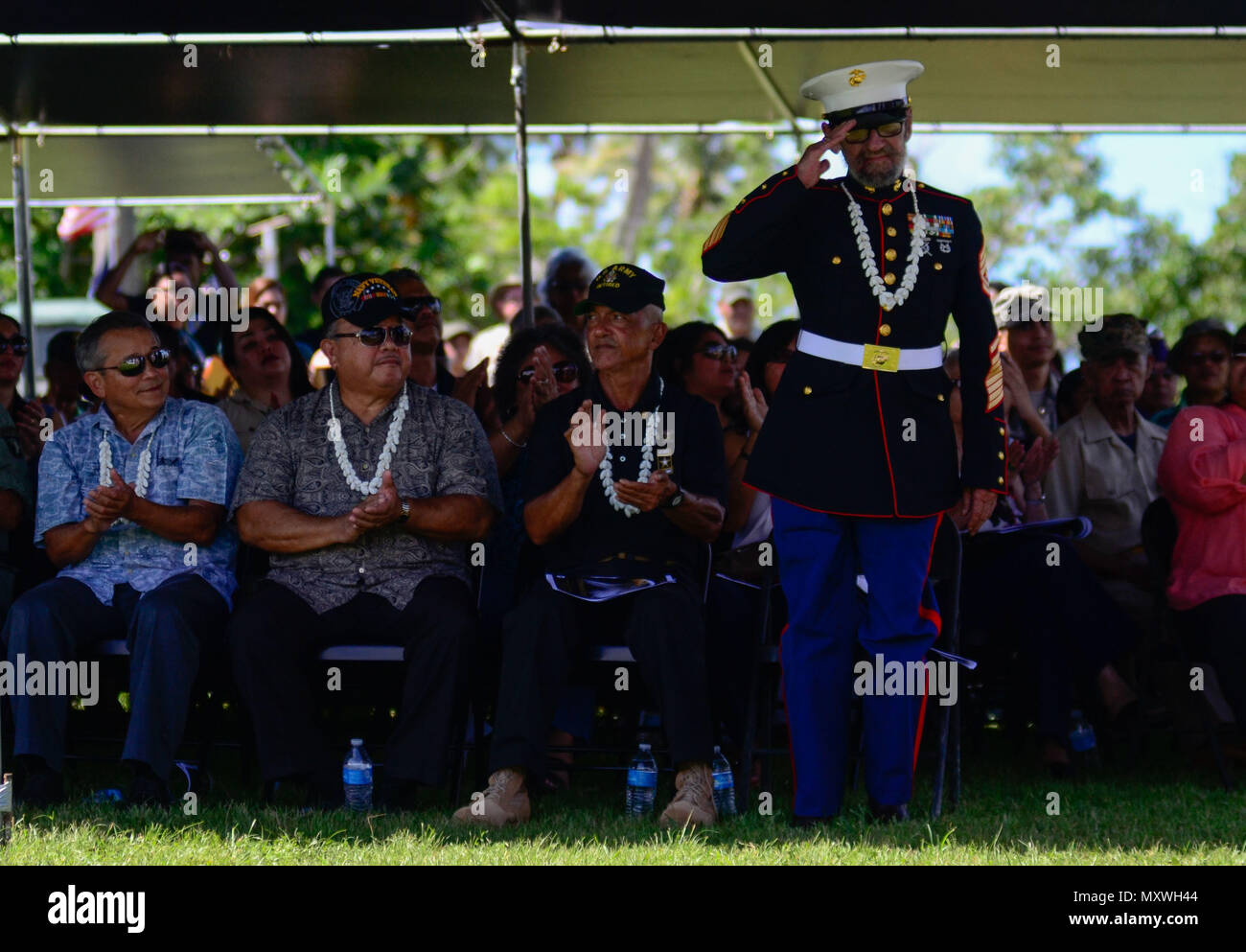 Former U.S. Marine Corps Gunnery Sgt. Raul Hinojosa salutes the ...