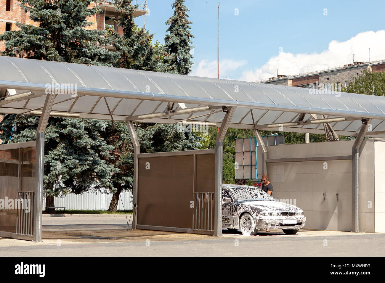 Car in outdoors self-service car wash, car in foam, toned Stock Photo ...
