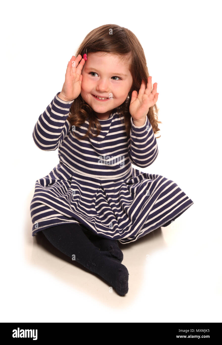 toddler girl playing peek a boo in a studio Stock Photo - Alamy