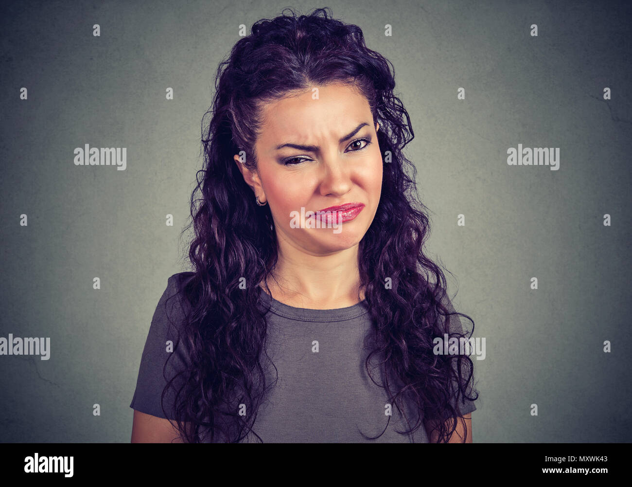 Casual girl looking super skeptically at camera with expression of ...