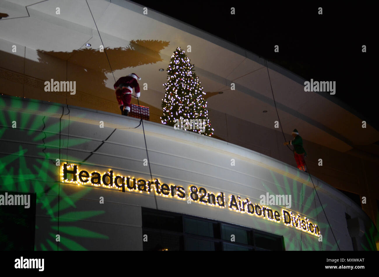 A Santa Claus assigned to the 82nd Airborne Division prepares to rappel ...