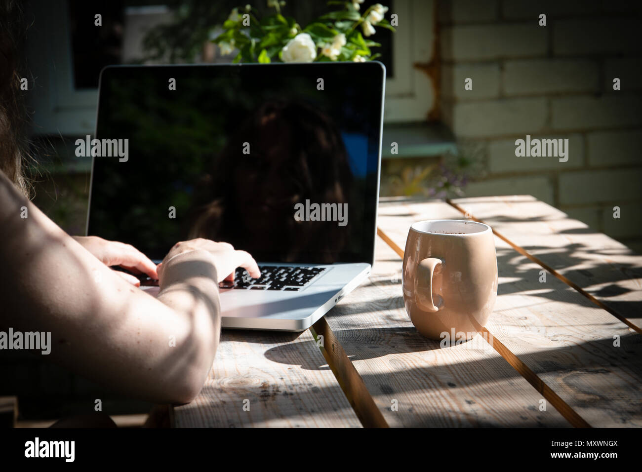 job with computer outdoors by wooden table at country, work from home ...