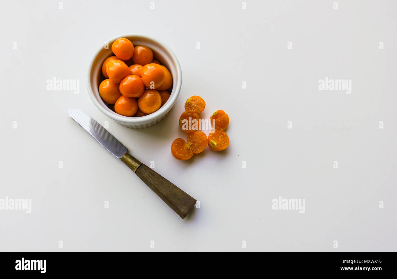 a bowl of golden sweet tangy cape gooseberries , an unique fruit to try ...