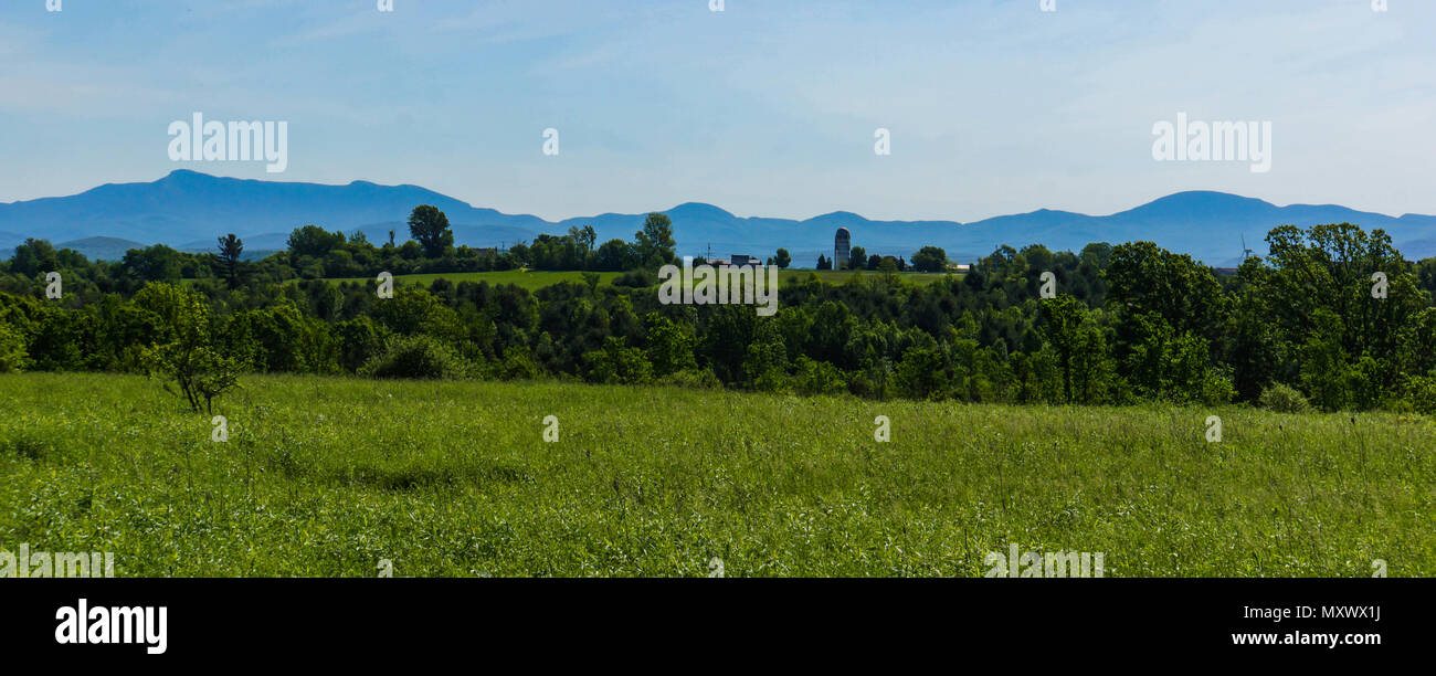 panorama of rural Vermont farm with the Green Mountains in the ...