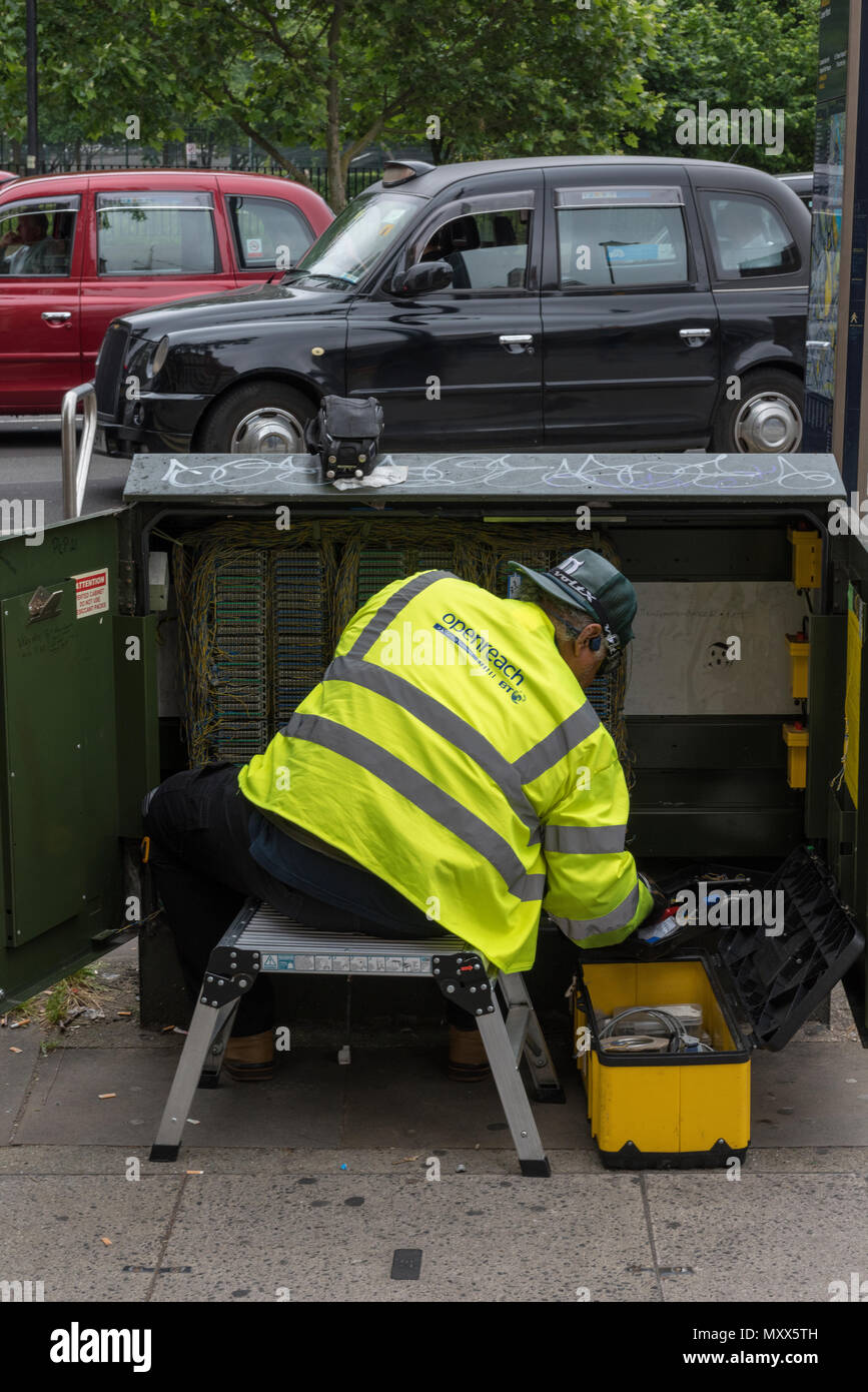 a telecoms engineer working for BT open reach telephone company working ...