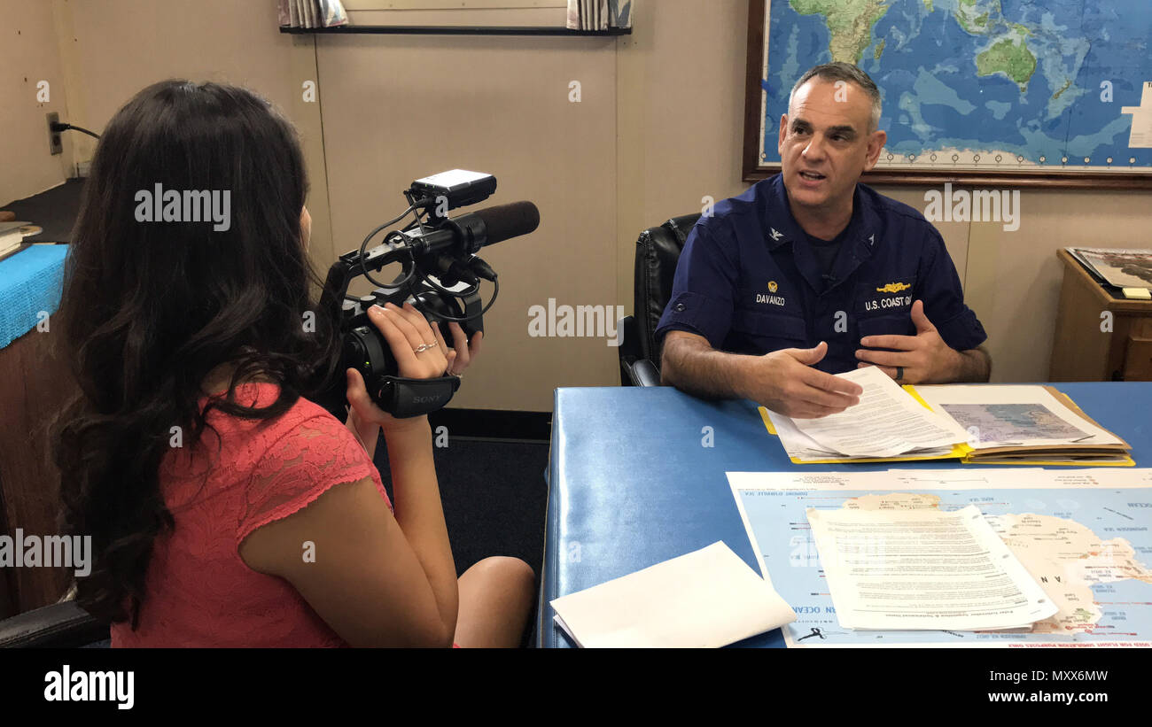 Local reporters interview Capt. Michael Davanzo, commanding officer of ...