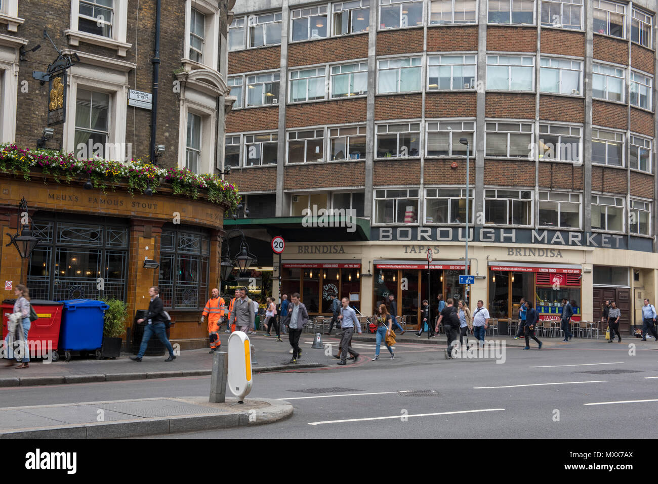 a busy morning during the rush hour outside of borough market in ...
