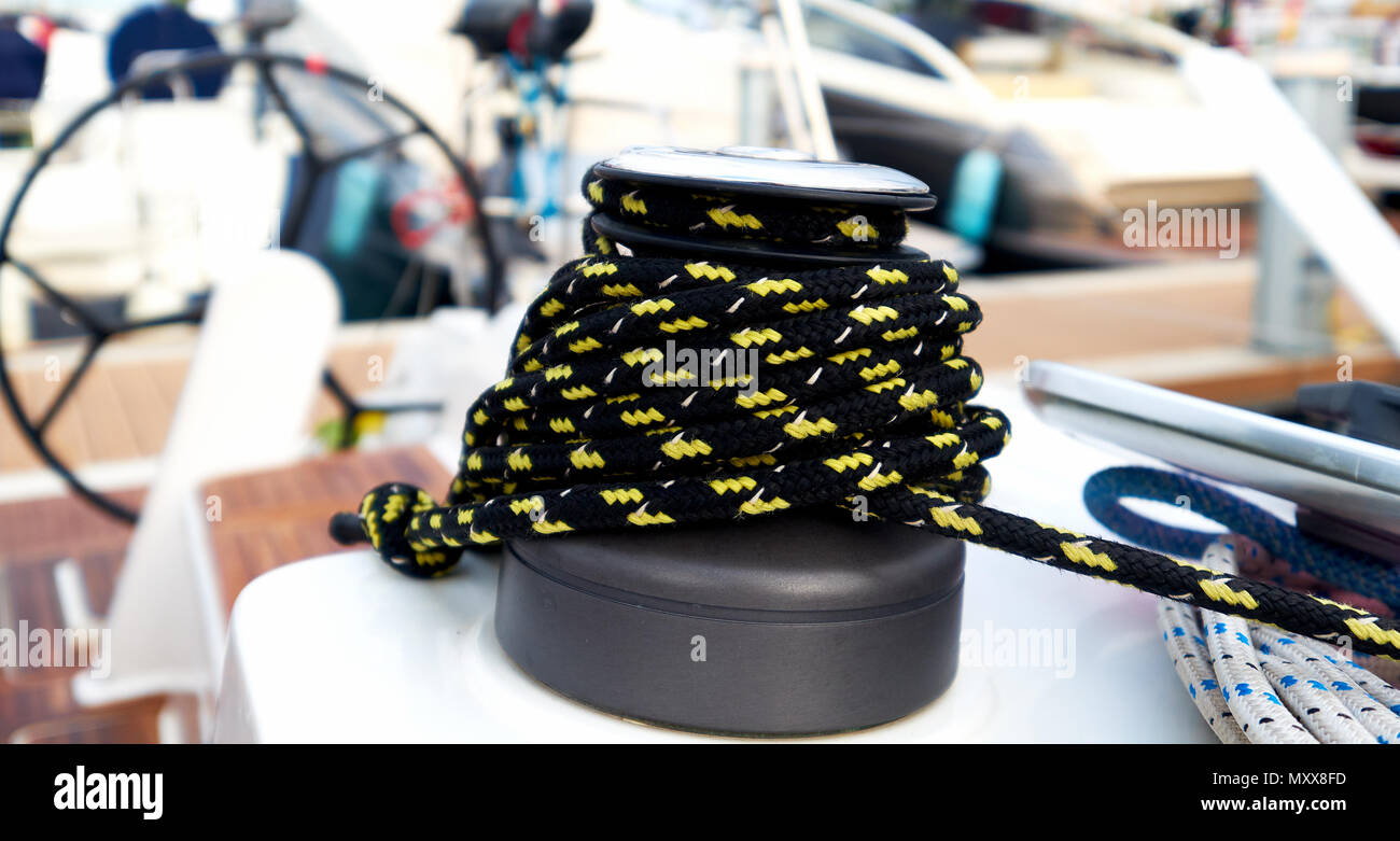 Winch with rope on sailing boat Stock Photo - Alamy