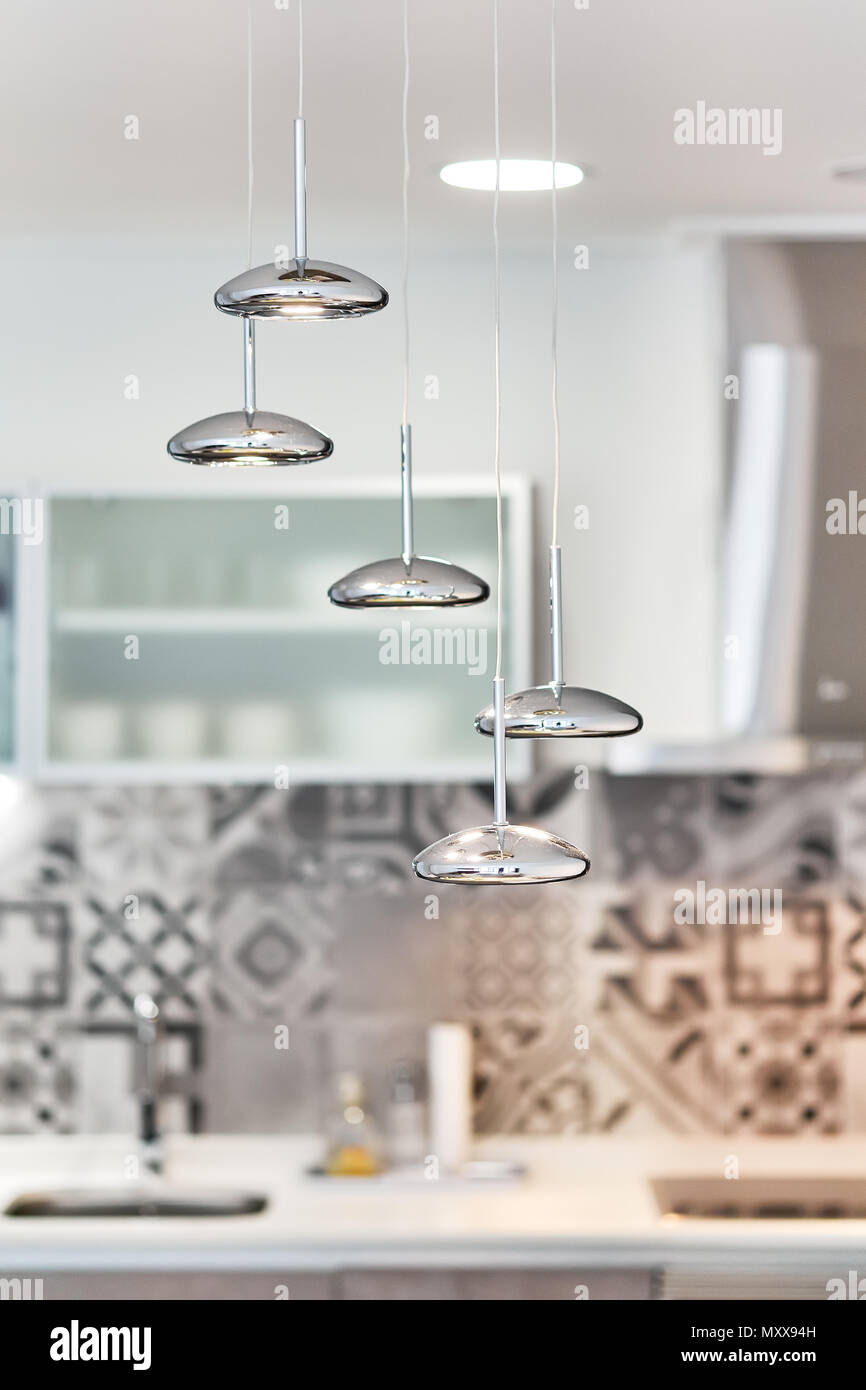 Modern silver lamp on a kitchen, selective focus Stock Photo - Alamy