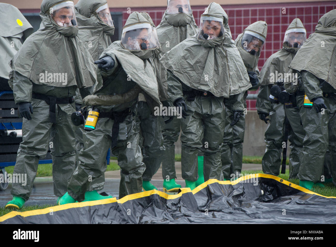 A decon team sets up a decontamination station during the 60th Air ...