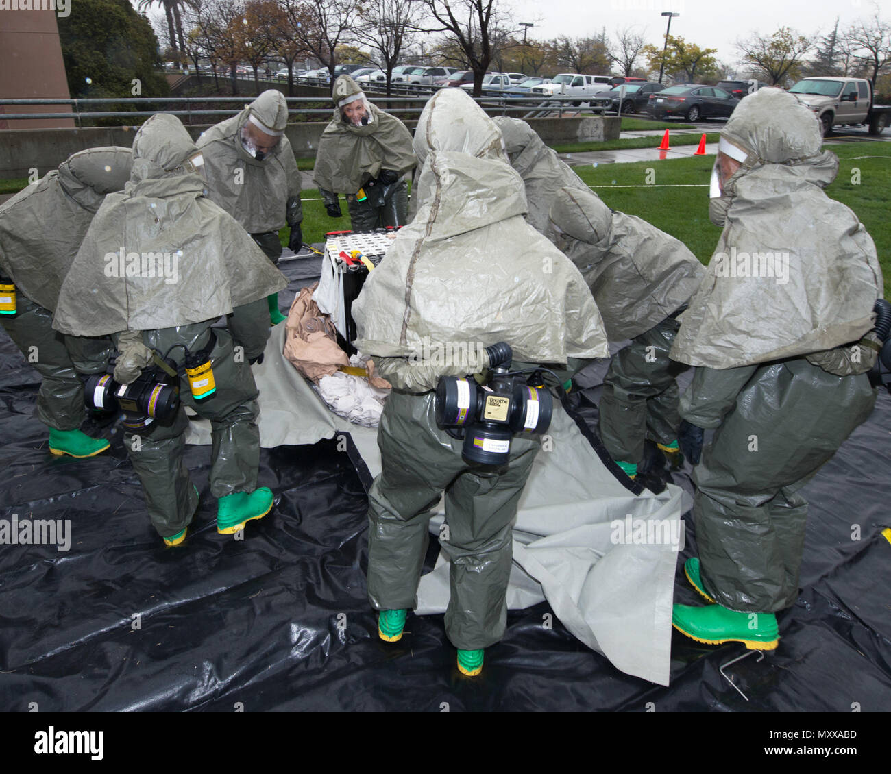 A decon team sets up a decontamination station during the 60th Air ...