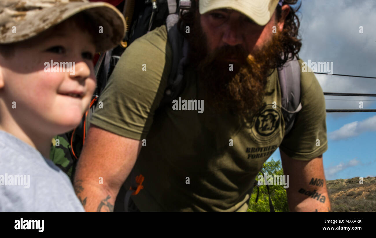 Jon Hancock, a Marine veteran, talks to his son in Marine Corps Base ...