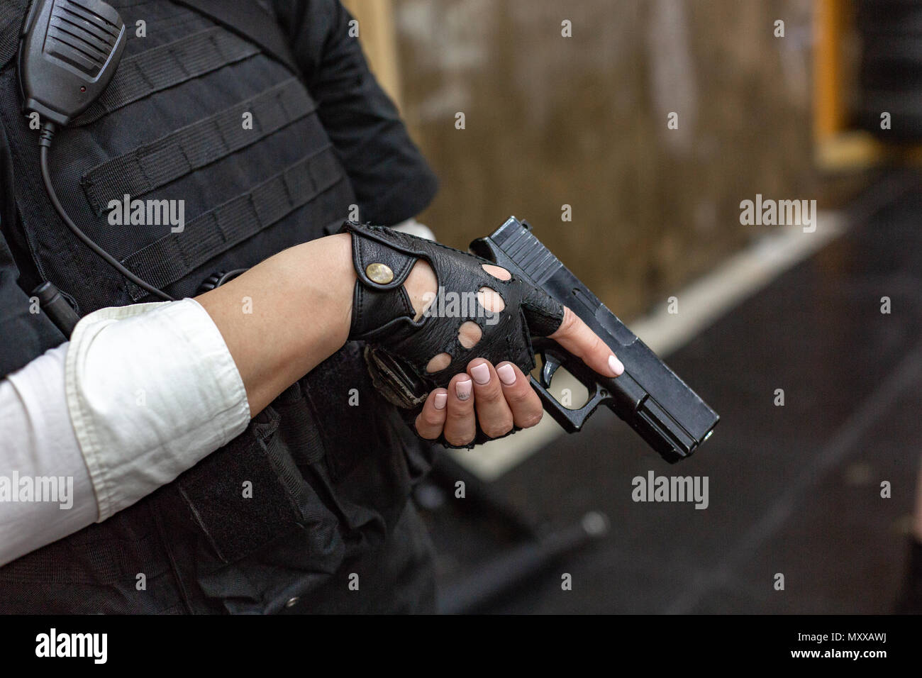 Powerful Woman Holding Gun. War Action Movie Style Stock Photo - Alamy