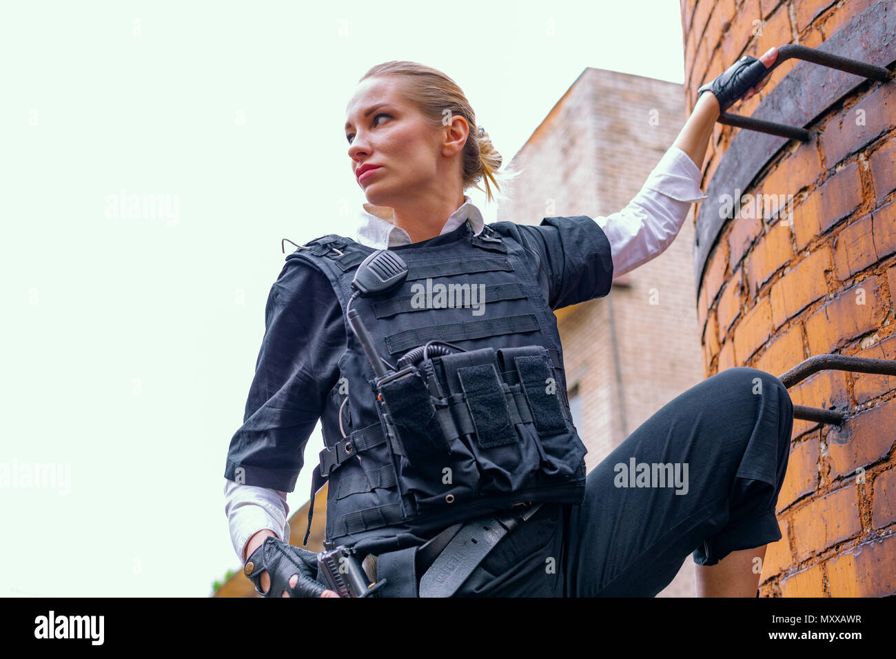 Powerful Woman Holding Gun. War Action Movie Style Stock Photo - Alamy