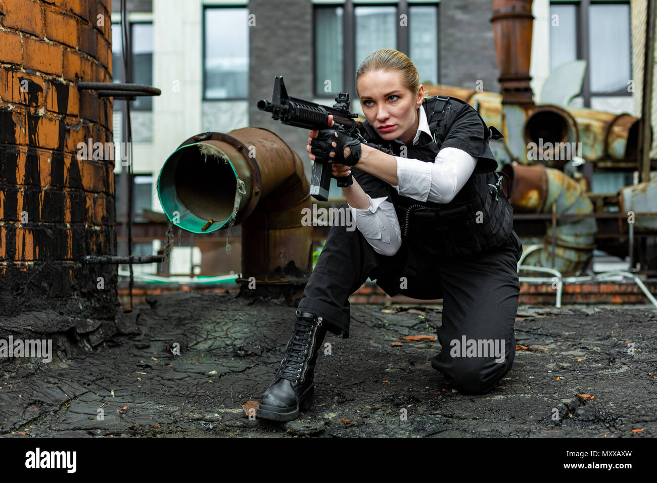 Powerful Woman Holding Gun. War Action Movie Style Stock Photo - Alamy