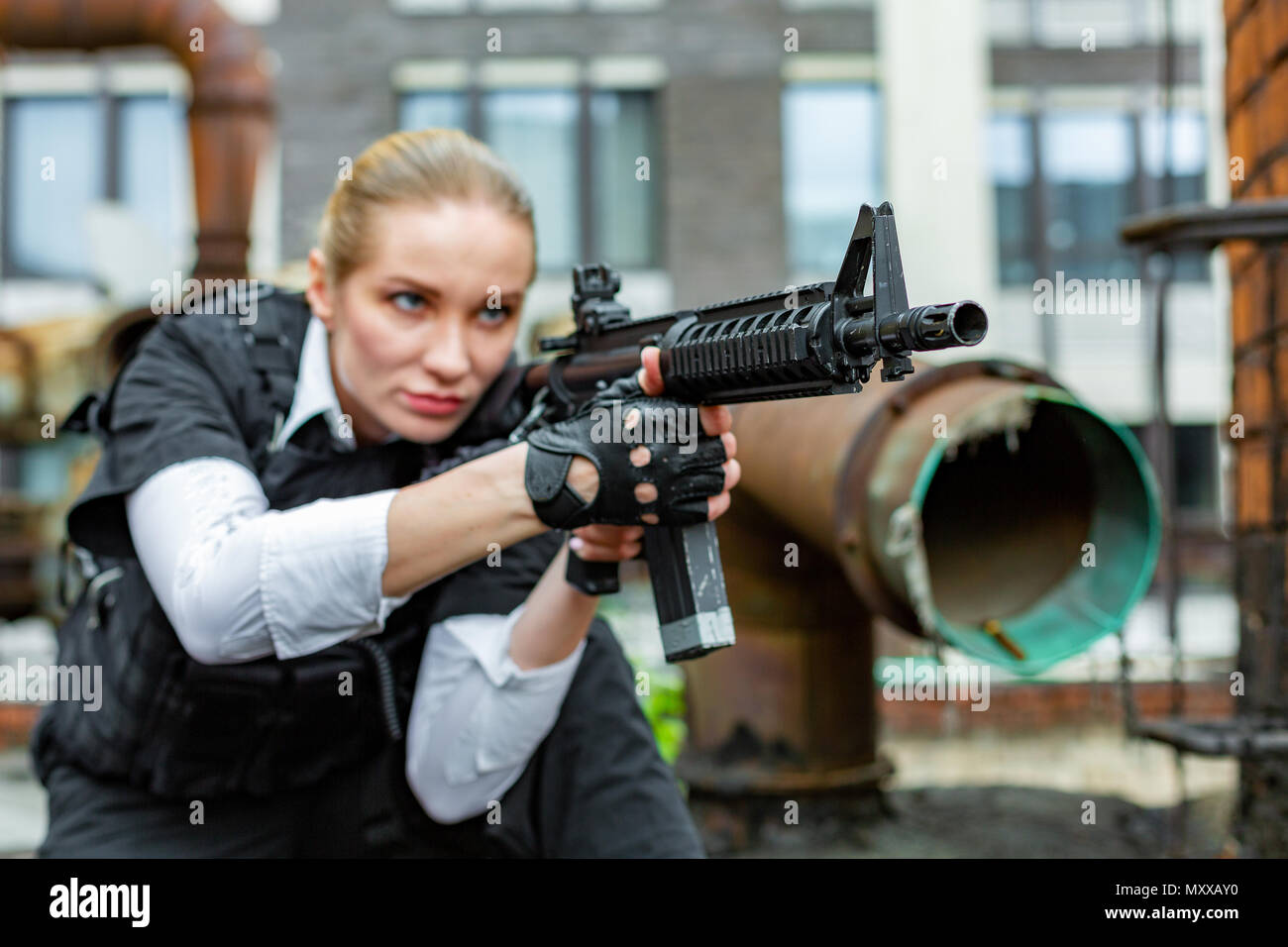 Powerful Woman Holding Gun. War Action Movie Style Stock Photo - Alamy
