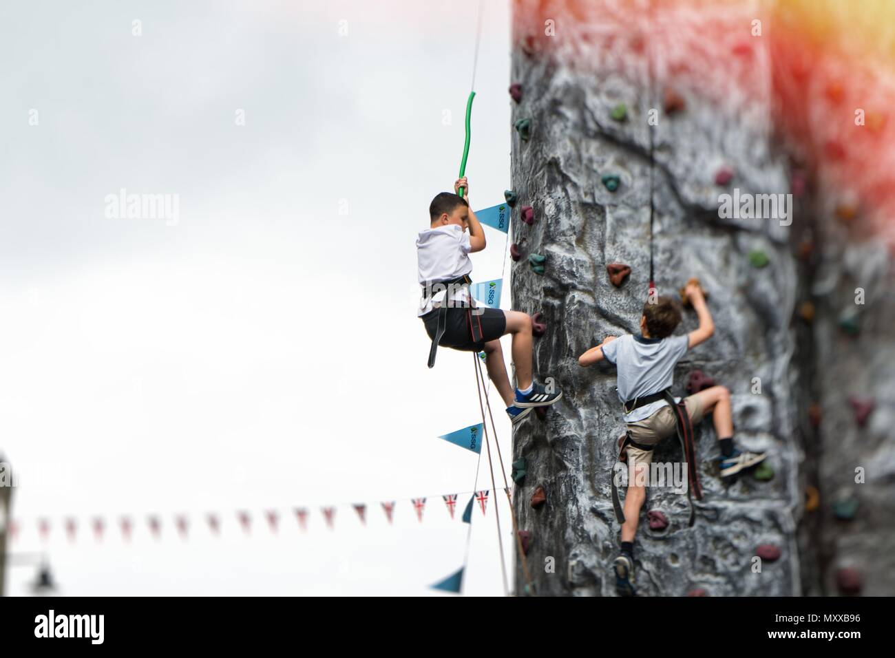 Bedford, Bedfordshire, UK, June 2, 2018.Young boys climbing wall Stock ...