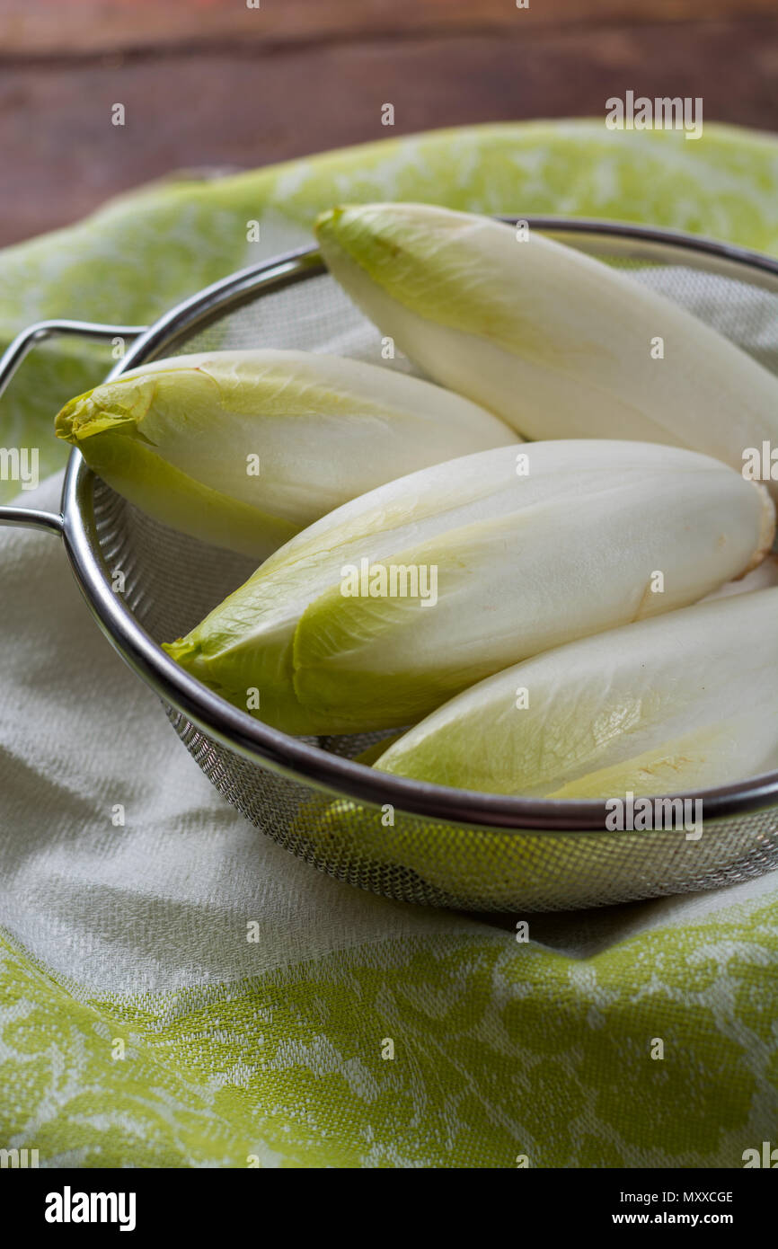 Fresh raw Belgian bitter chicory salad ready to eat, close up Stock ...