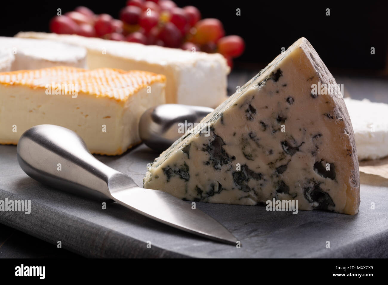 French cheeses plate in assortment, blue cheese, brie, munster, soft ...