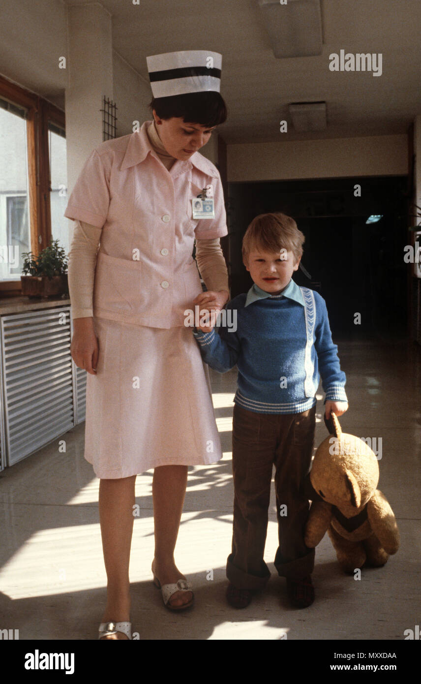 Polish nurse with young child patient in children's clinic, Warsaw ...