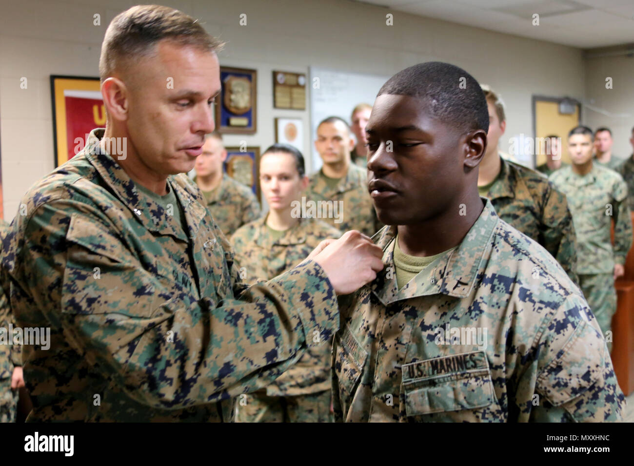 Brig. Gen. Matthew Glavy, left, removes private first class rank ...