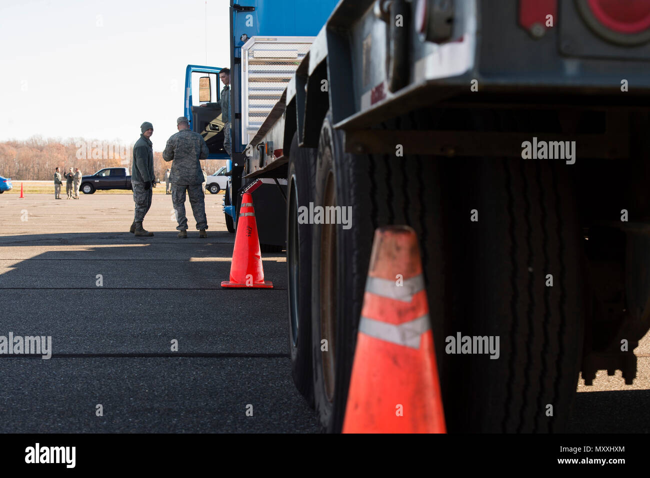 A tractor trailer is parked parallel between cones while vehicle ...
