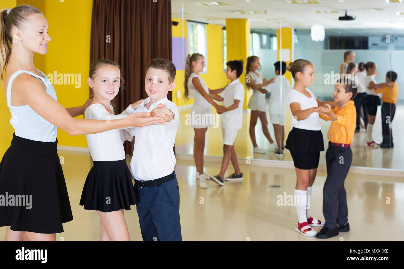 Active children enjoying of partner dance in class Stock Photo - Alamy
