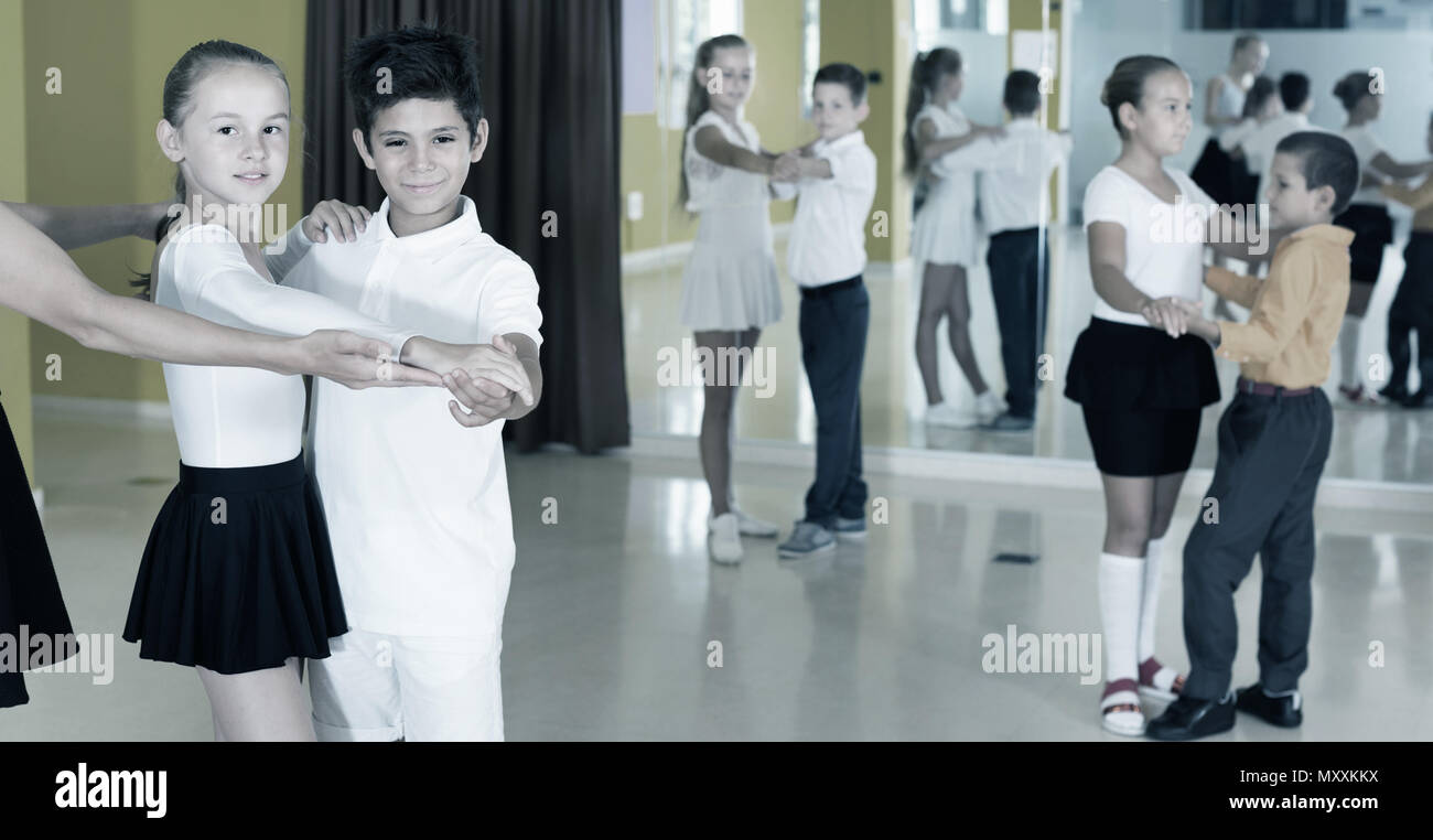 Group of diligent children dancing tango in dance studio Stock Photo ...