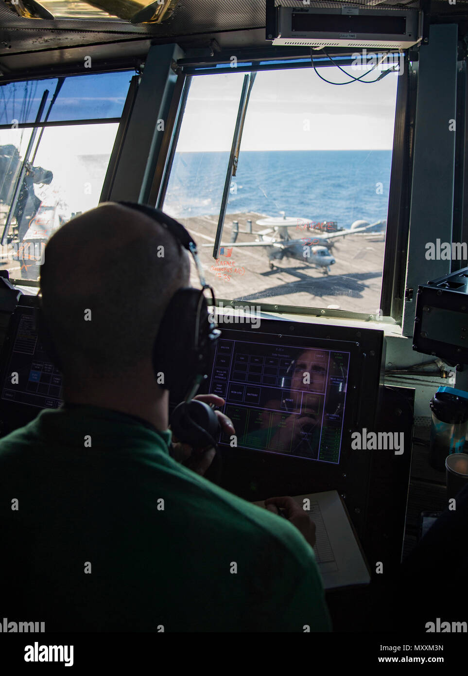 A Petty Officer inspects and verifies aircraft arresting gear weight ...