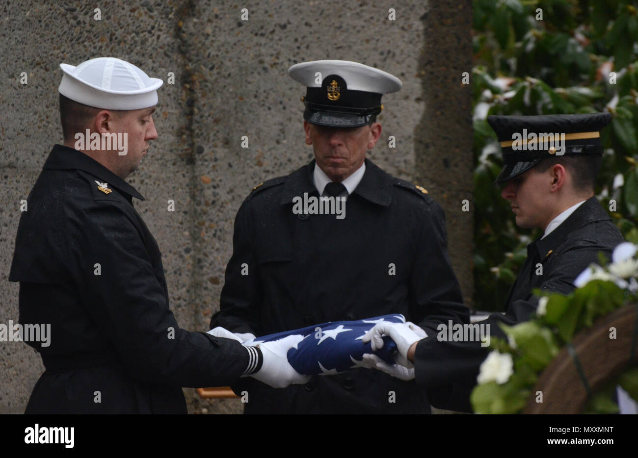 A joint service military funeral Honor Guard team performs a formal flag folding ceremony, Dec ...