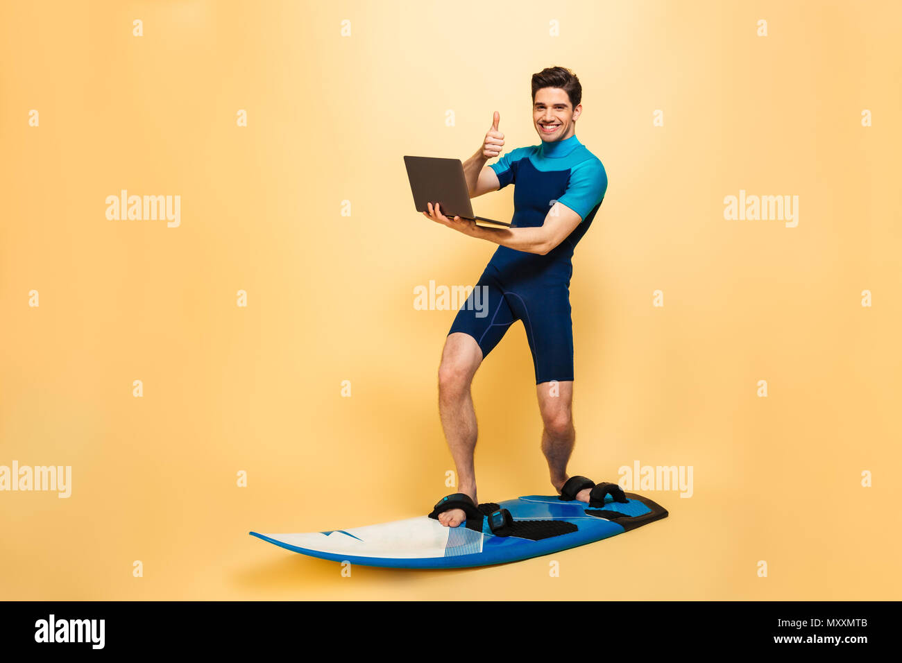 Full length portrait of a confident young man dressed in swimsuit ...