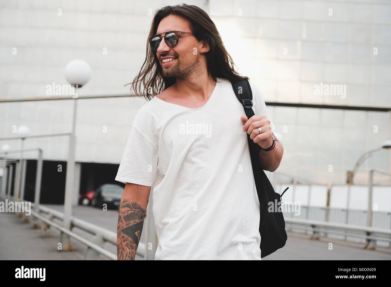 Happy man walking in the city Stock Photo - Alamy