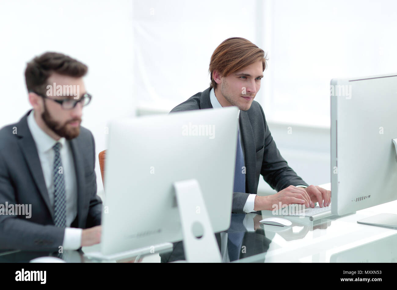 Company employees working in software development Stock Photo - Alamy