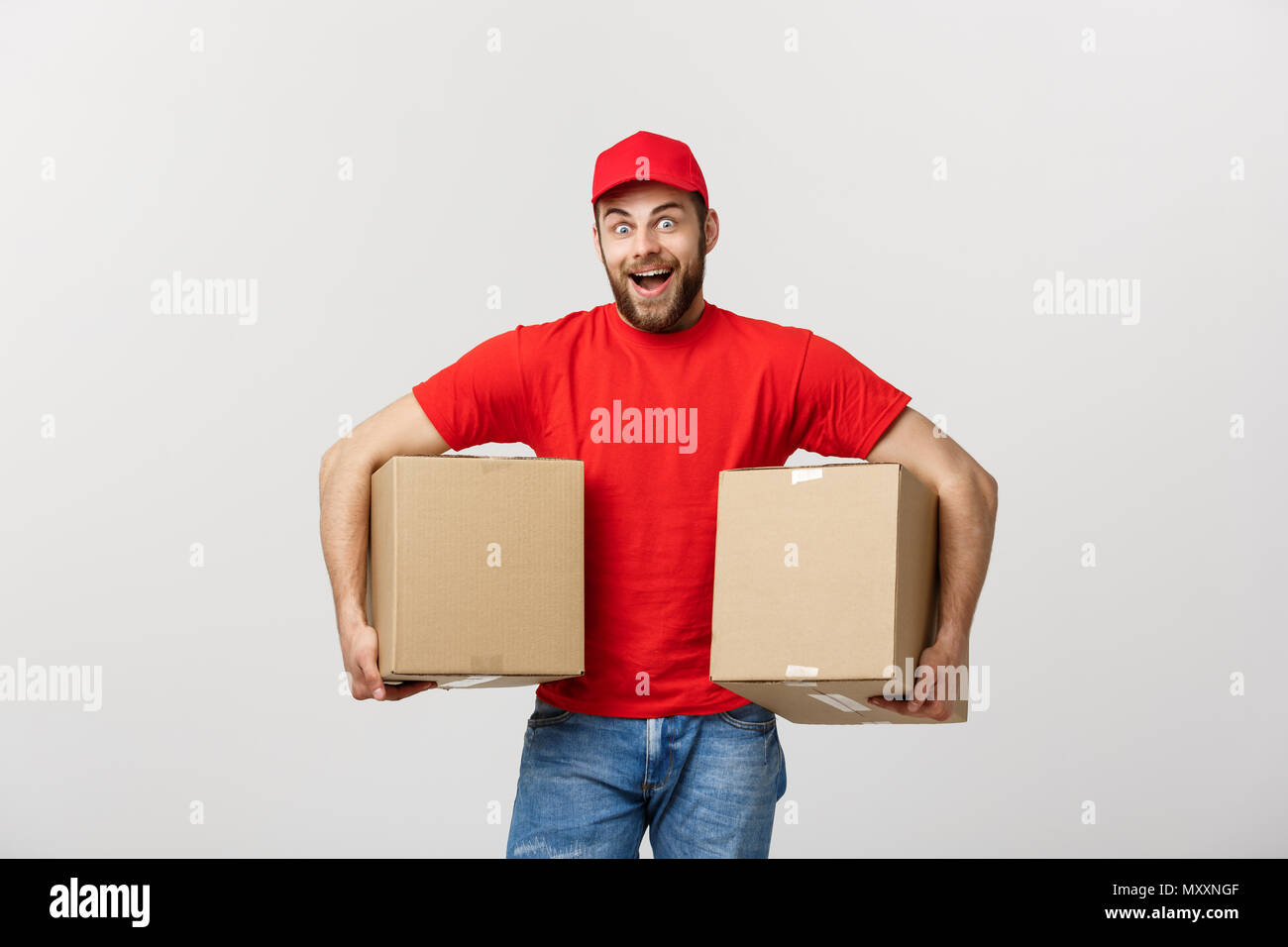 Portrait delivery man in cap with red t-shirt working as courier or ...