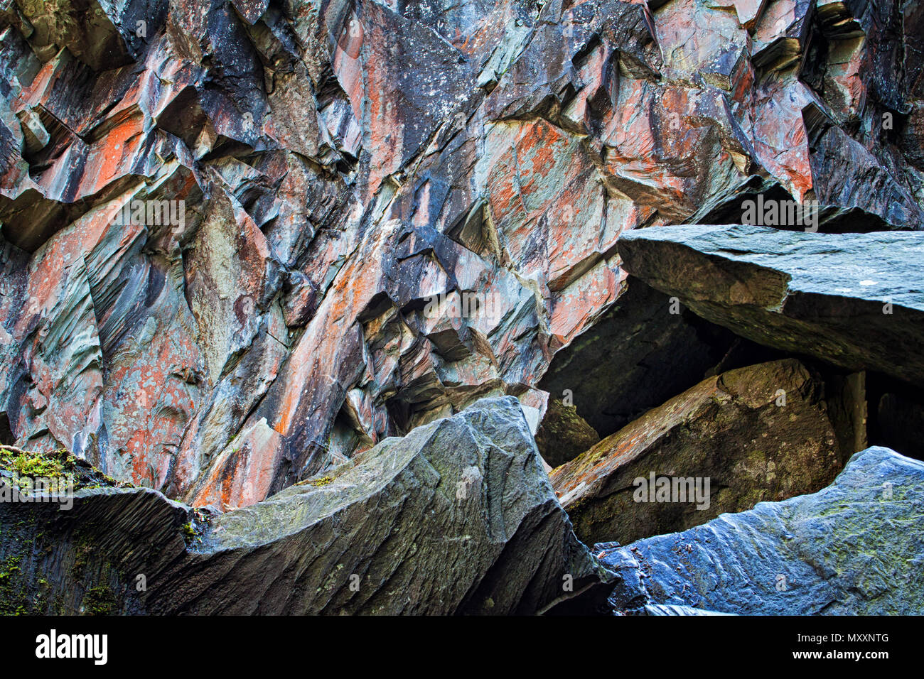Looking over a pile of slate and rocks at the colourful pattern created ...